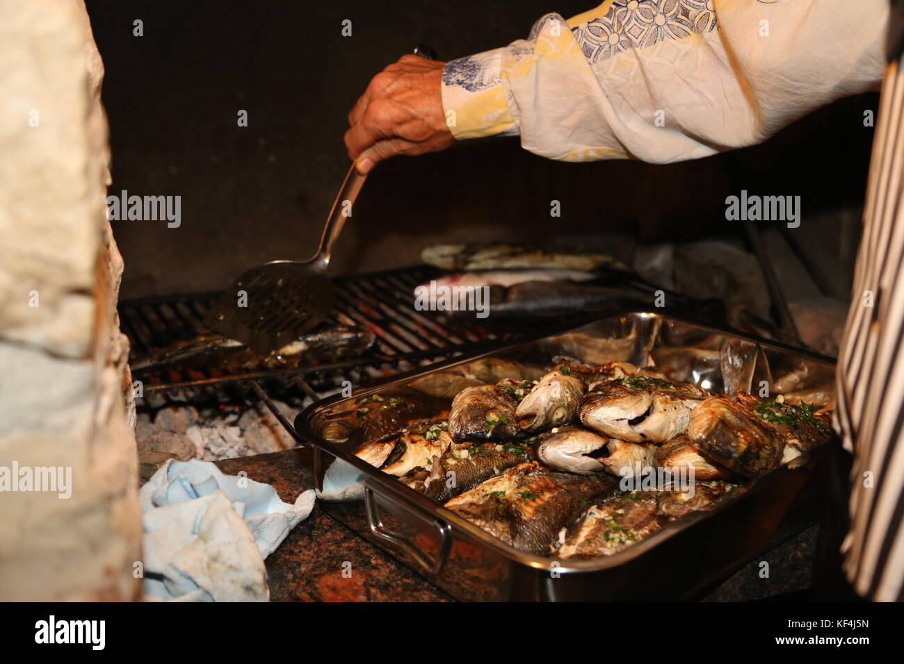 Fish grill / There are fish on the grill and grilled. An raw freshwater ...