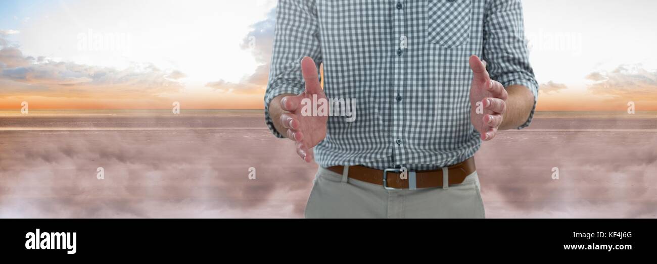 Digital composite of Businessman holding invisible air space in front ...
