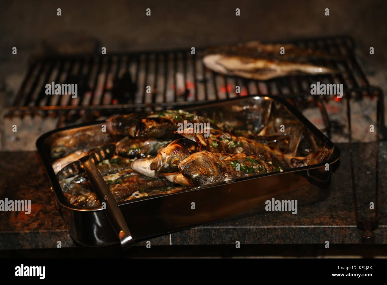 Fish grill / There are fish on the grill and grilled. An raw freshwater ...