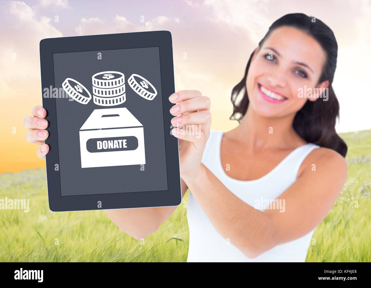 Digital composite of Woman holding tablet with donate box and money ...