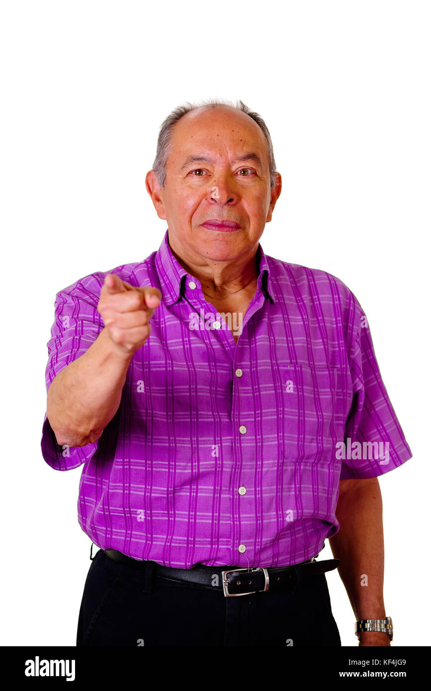 Portrait of a happy old man, pointing with his hand to somewhere ...