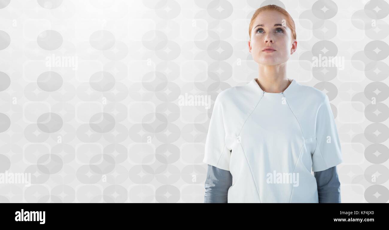 Digital composite of Woman looking up with bright pattern background ...