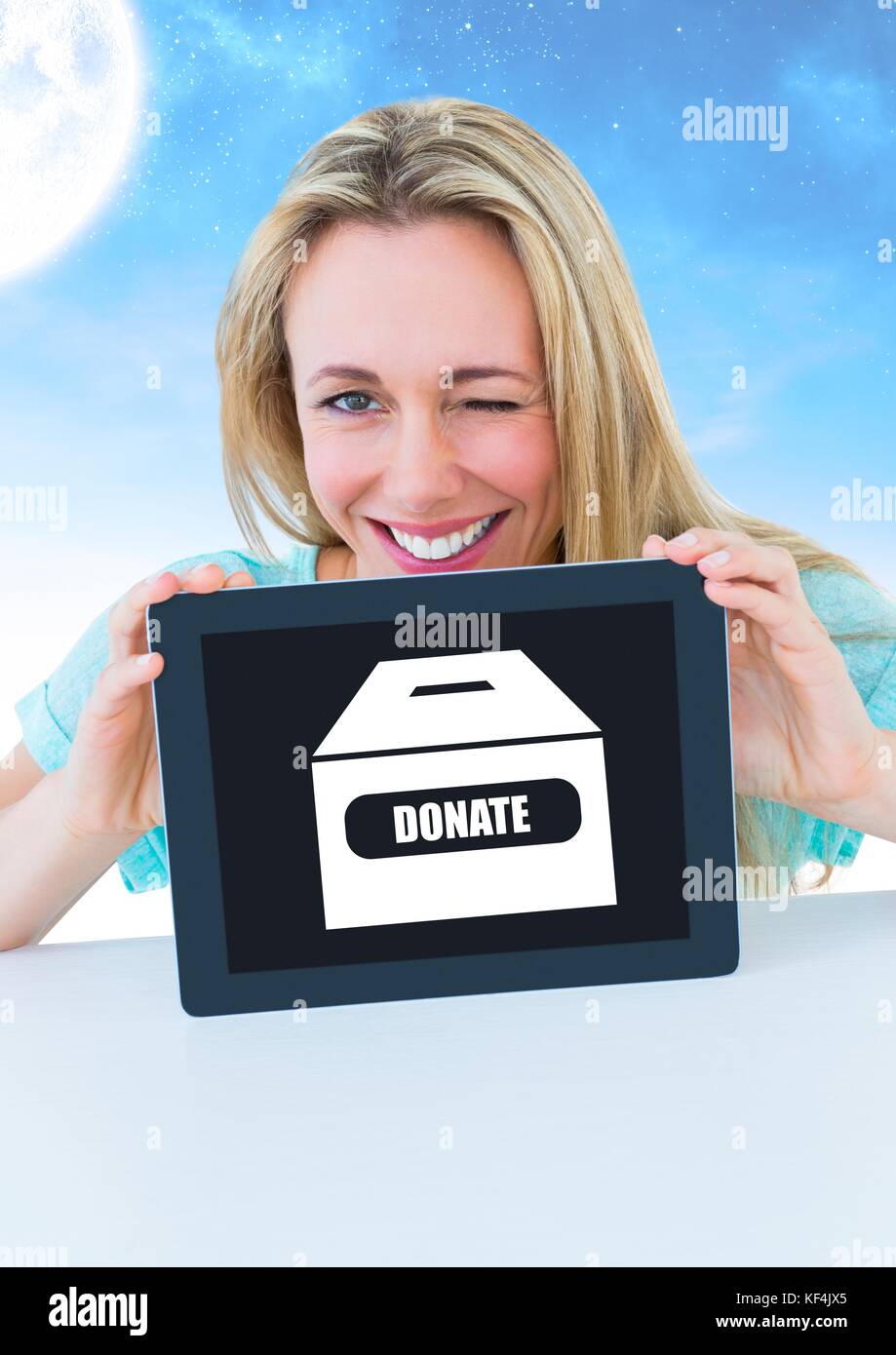 Digital composite of Woman holding tablet with donate box icon Stock ...
