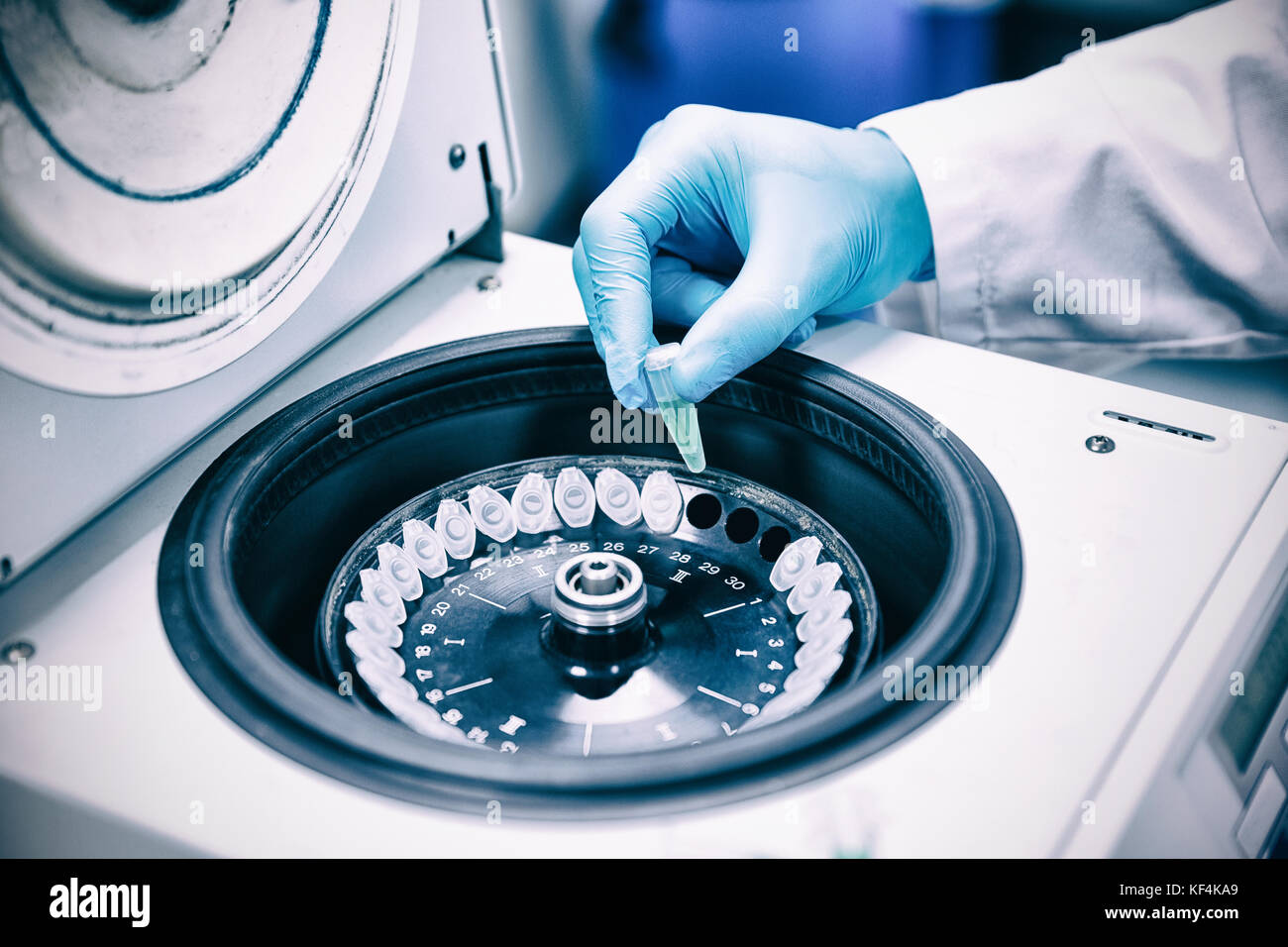 Close up of a chemist using a centrifuge in lab Stock Photo - Alamy