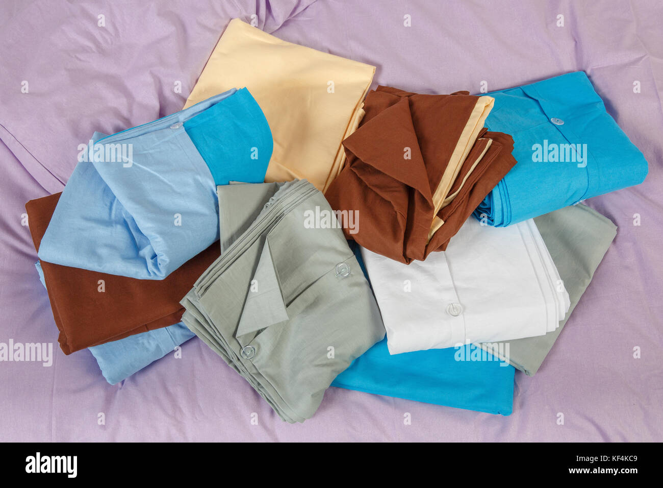 stacks colourful bed linen textiles clothing background pile concept ...