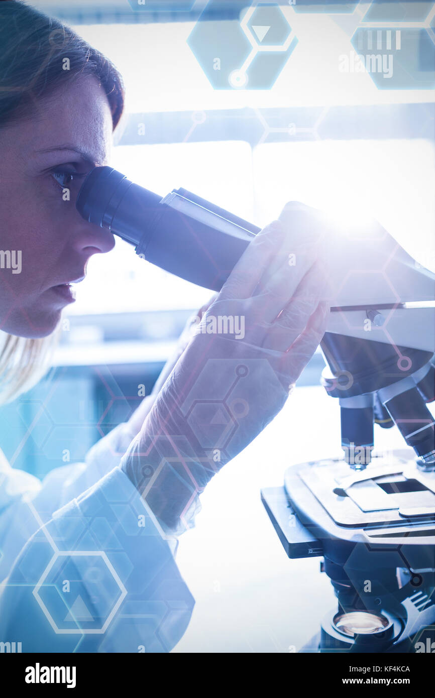Graph digital against scientist working on microscope Stock Photo - Alamy