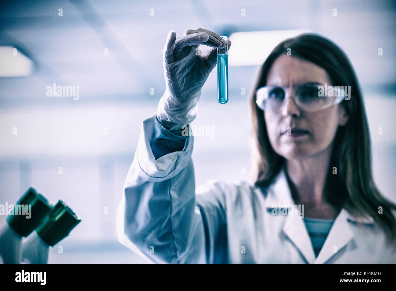 Scientist looking at test tube in the laboratory at the university ...
