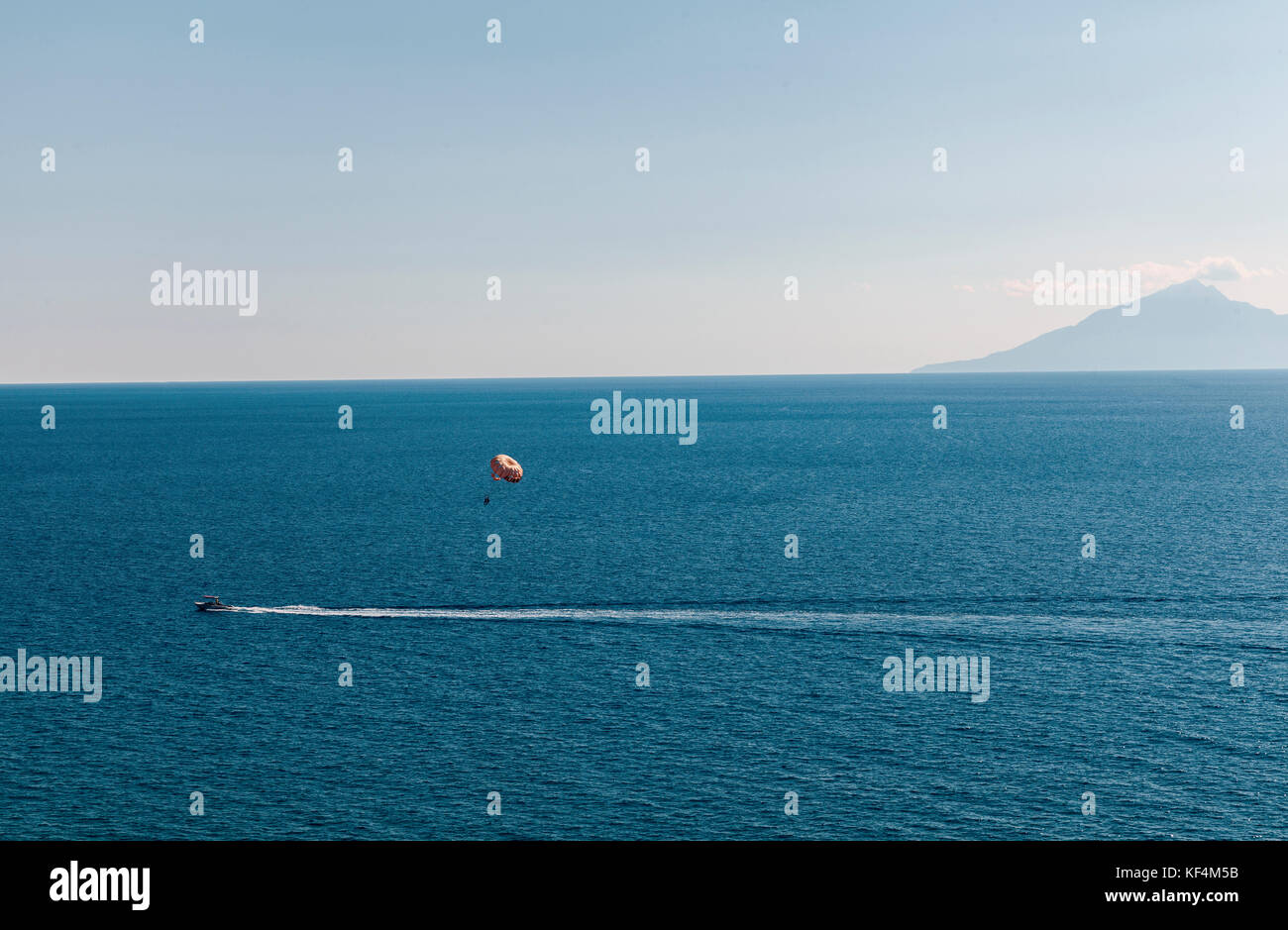 parasailing on sea with island Atos in Greece Stock Photo - Alamy