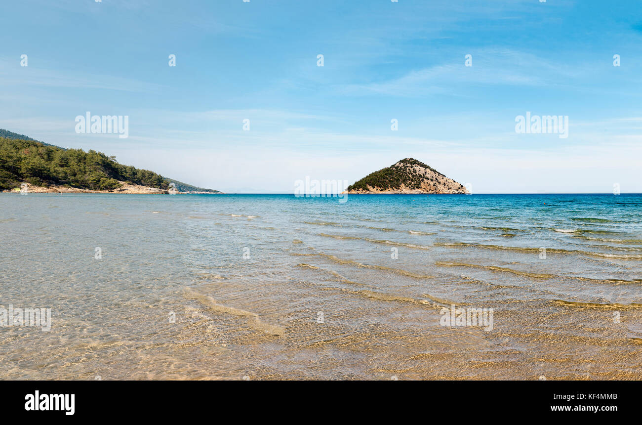 beach with small island, deep blue water surface Stock Photo - Alamy
