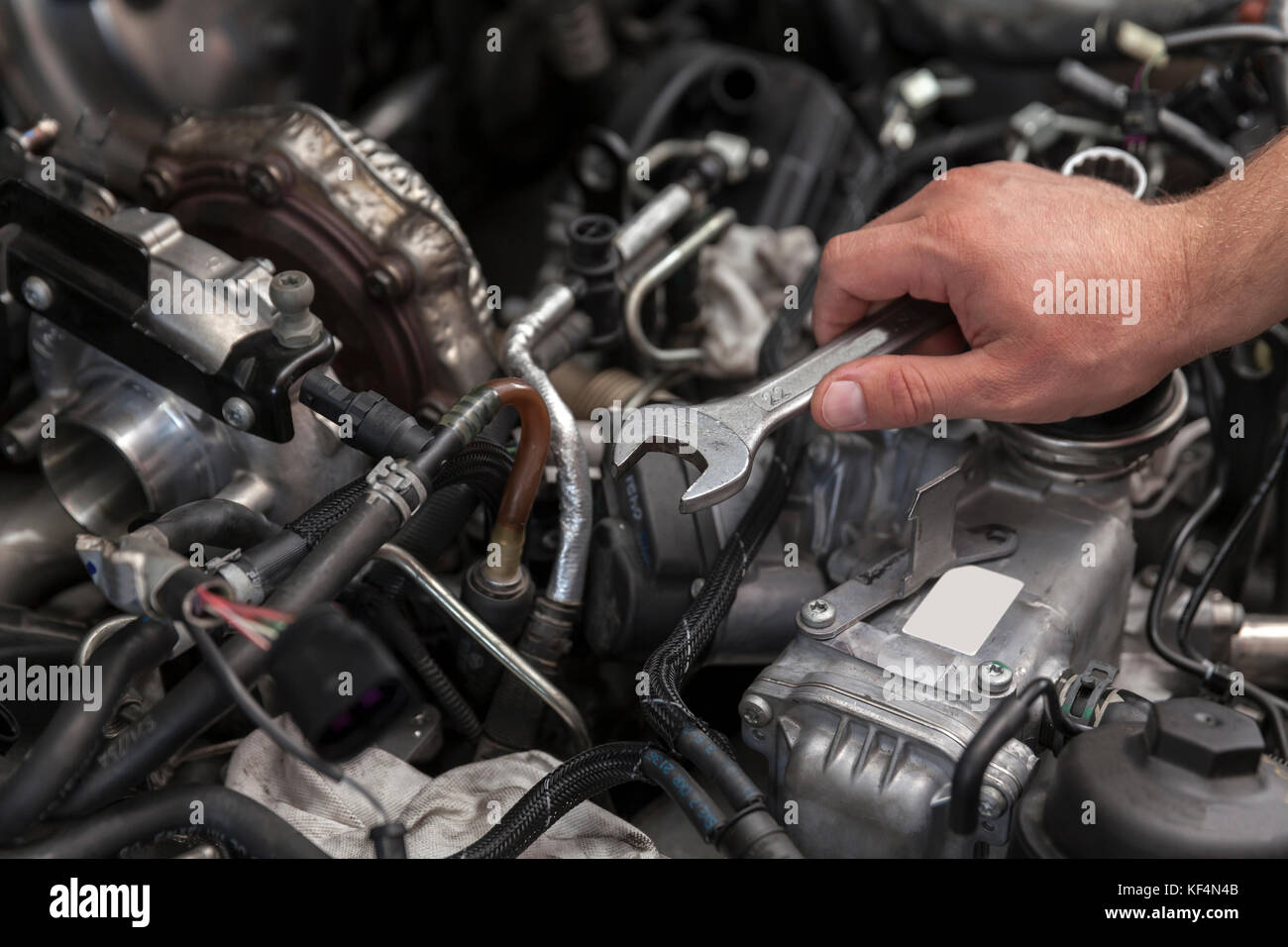 mechanic working on engine repairs, close up Stock Photo - Alamy
