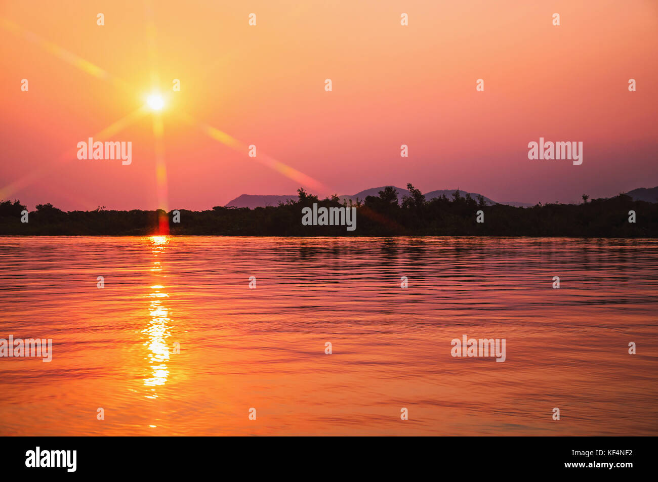 Amazing sunset at Paraguai river in Pantanal, Brazil. The river and the ...