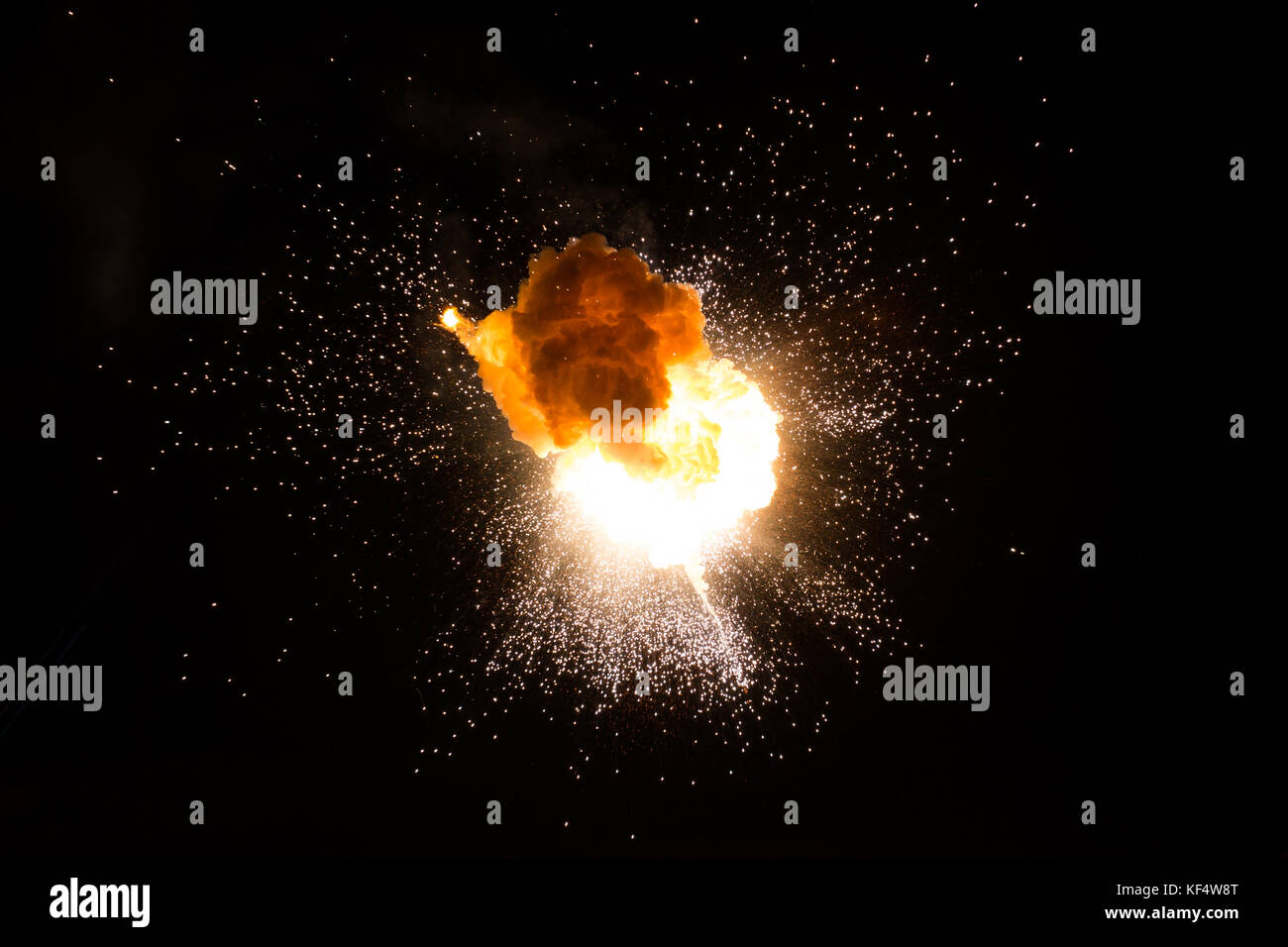 Realistic fiery explosion with sparks over a black background. Fireball ...