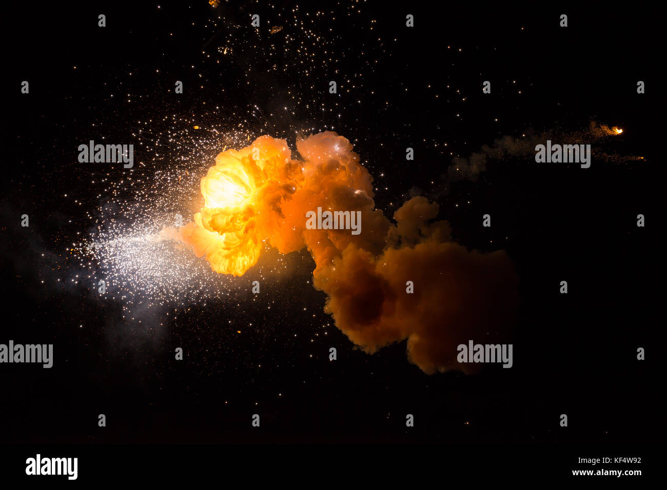 Realistic fiery explosion with sparks over a black background. Fireball ...
