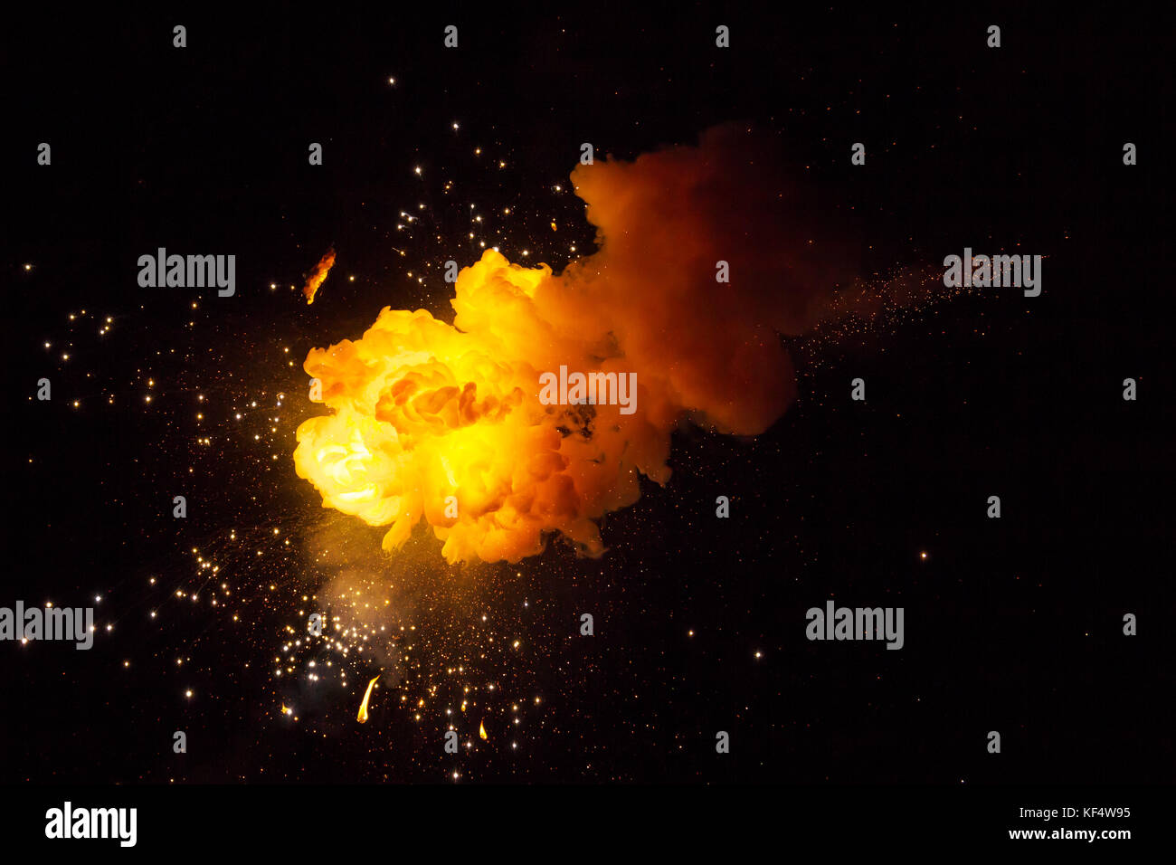 Realistic fiery explosion with sparks over a black background. Fireball ...