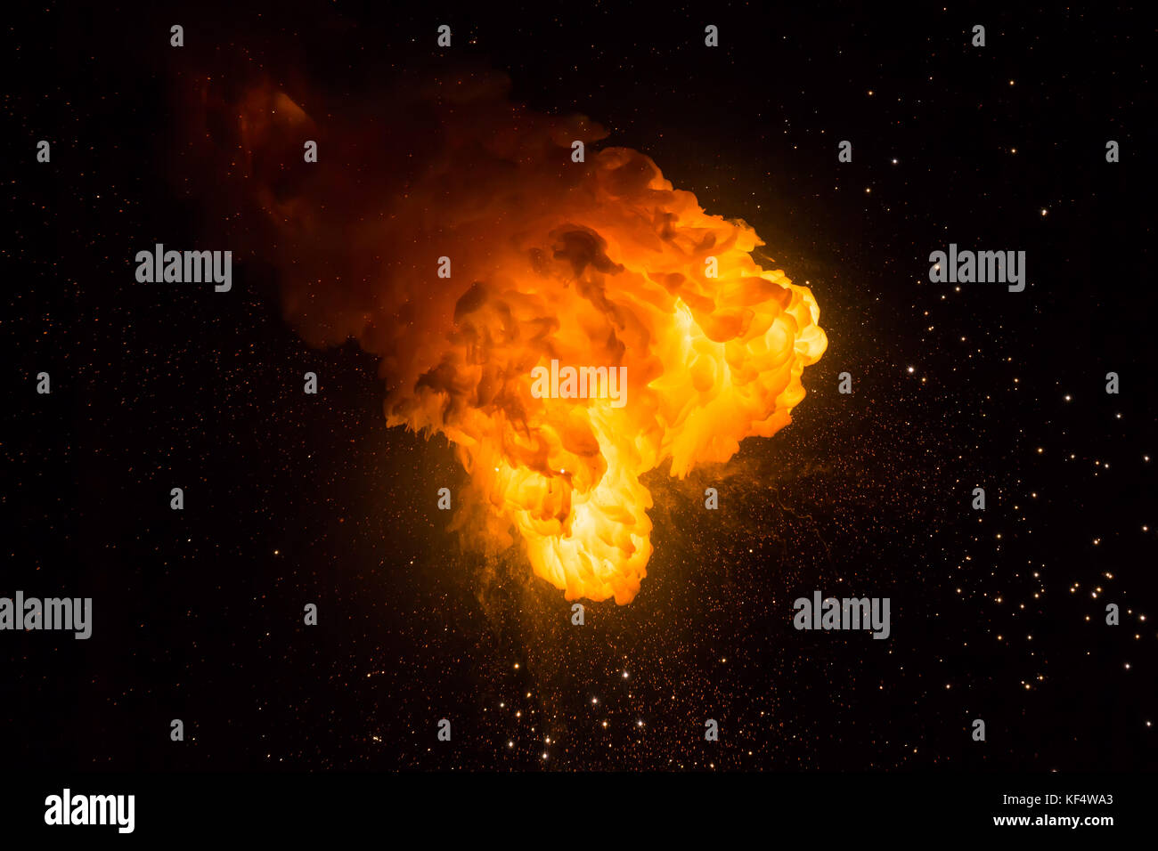 Realistic fiery explosion with sparks over a black background. Fireball ...
