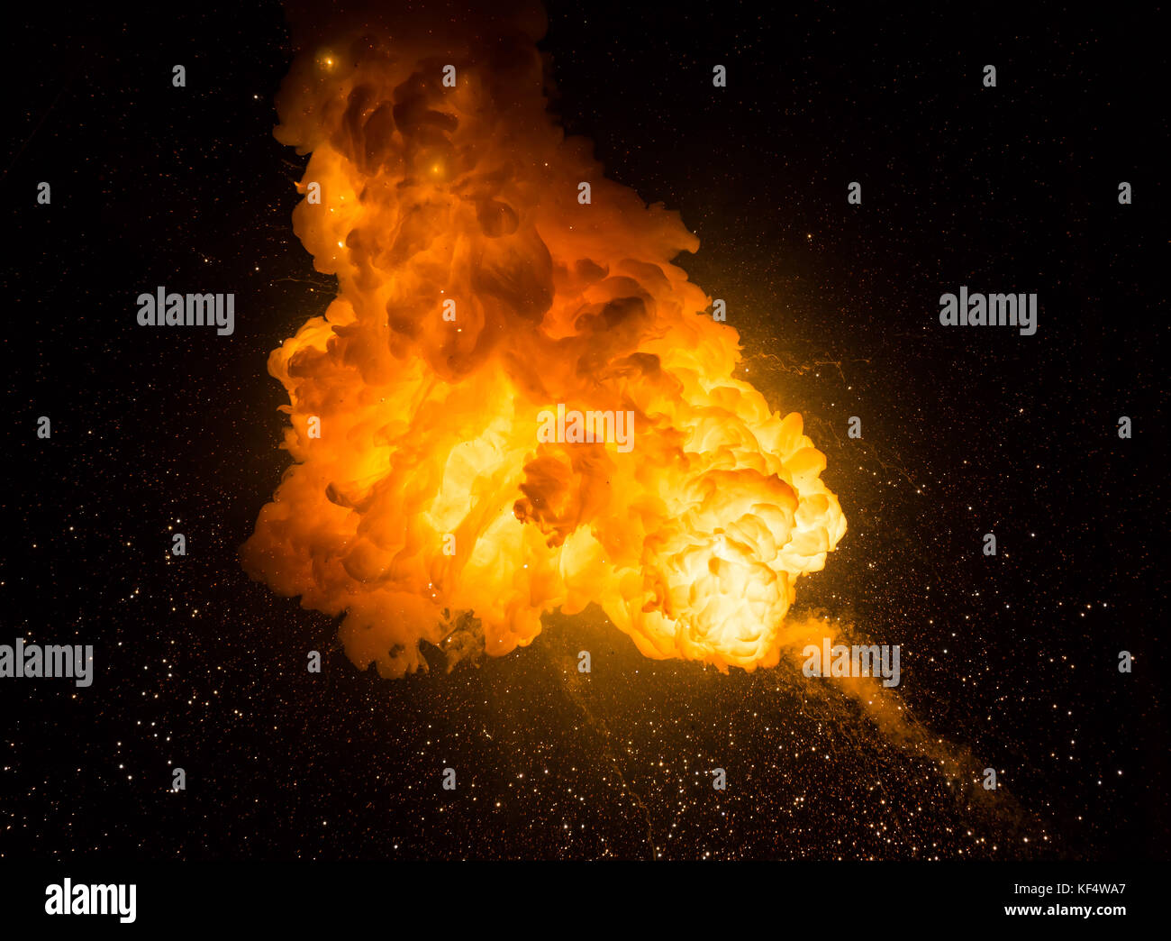 Realistic fiery explosion with sparks over a black background. Fireball ...
