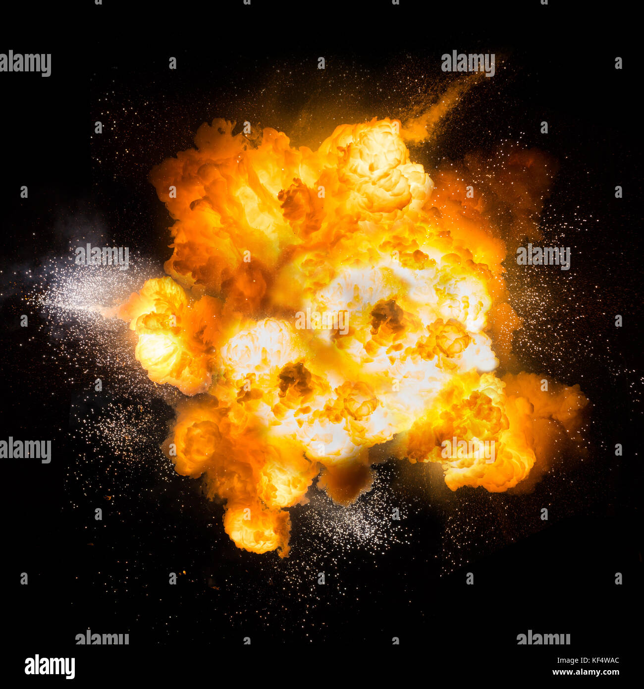 Realistic fiery explosion with sparks over a black background. Fireball ...