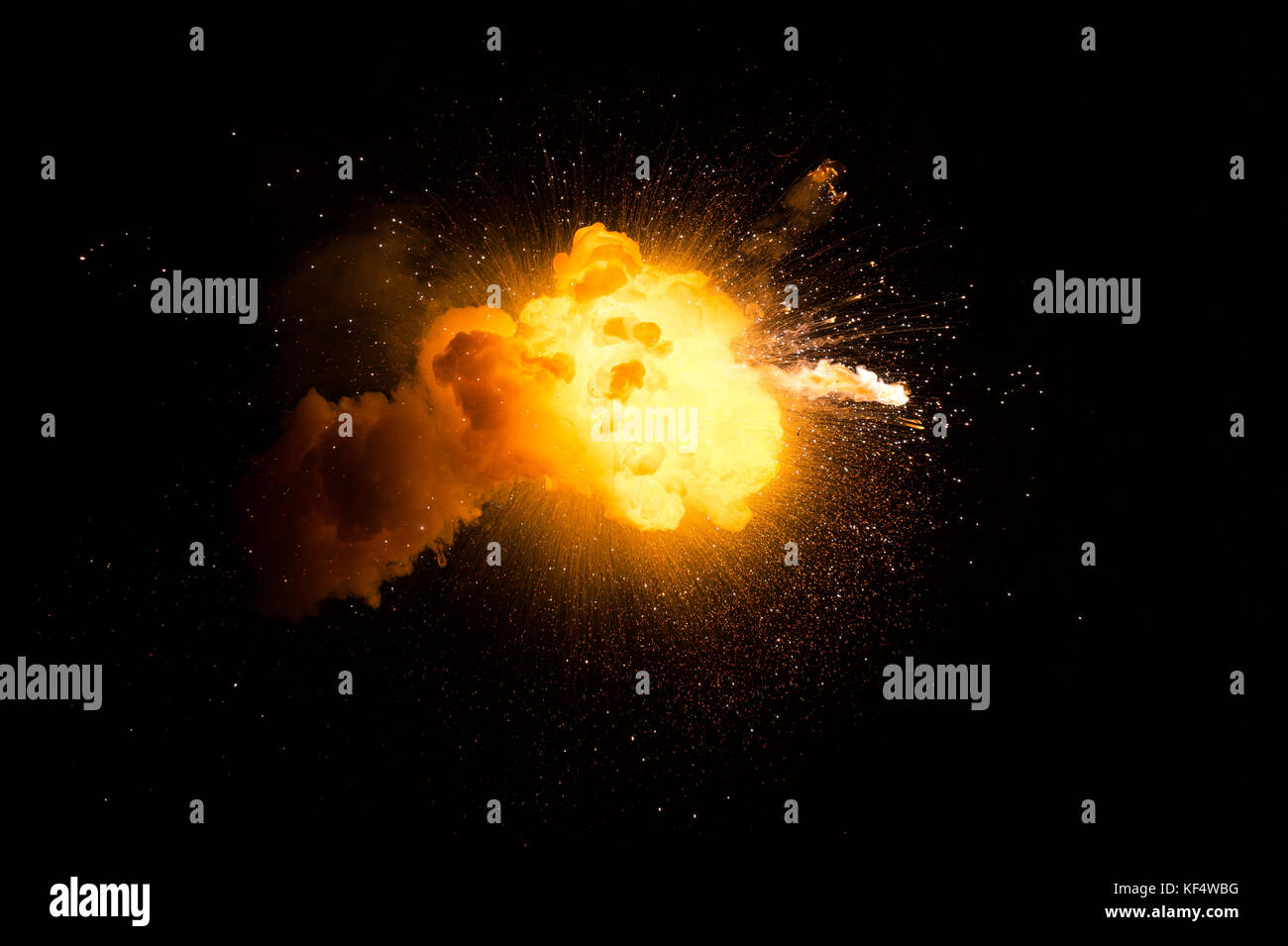 Realistic fiery explosion with sparks over a black background. Fireball ...