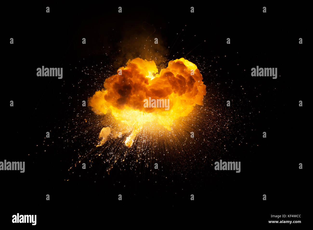 Realistic fiery explosion with sparks over a black background. Fireball ...