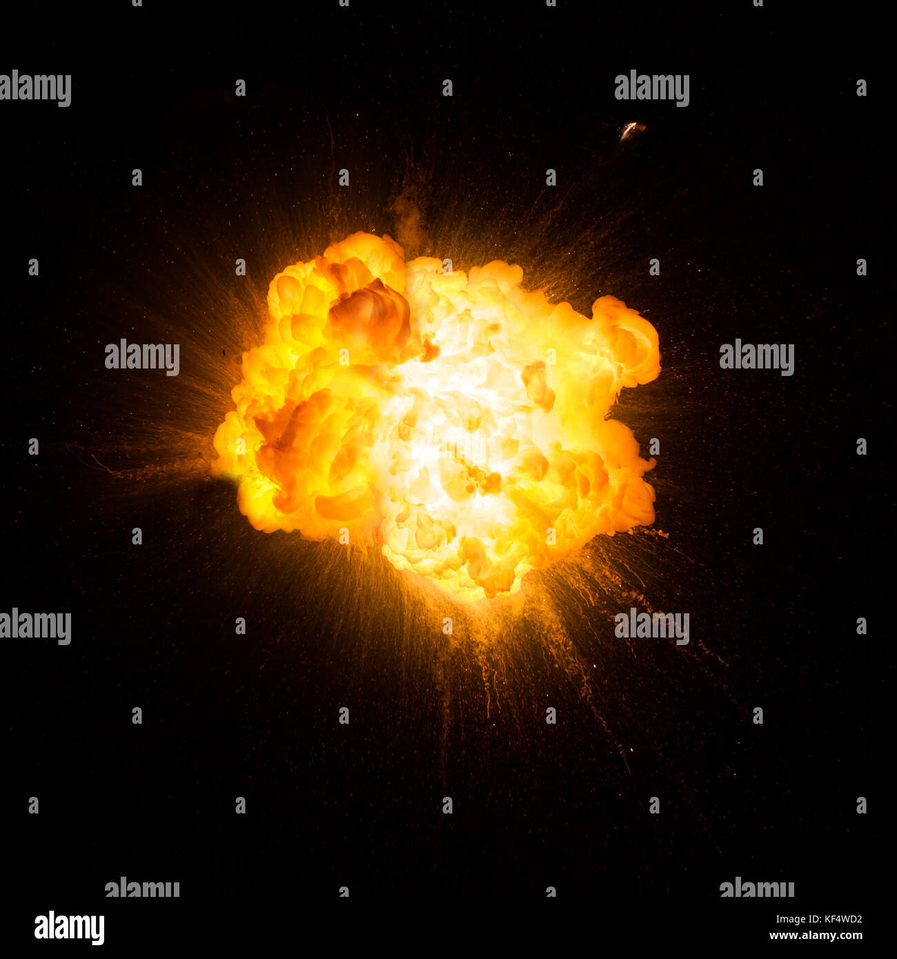 Realistic fiery explosion with sparks over a black background. Fireball ...