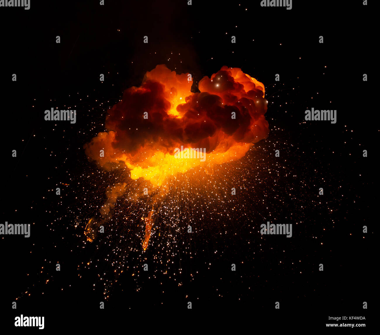 Realistic fiery explosion with sparks over a black background. Fireball ...