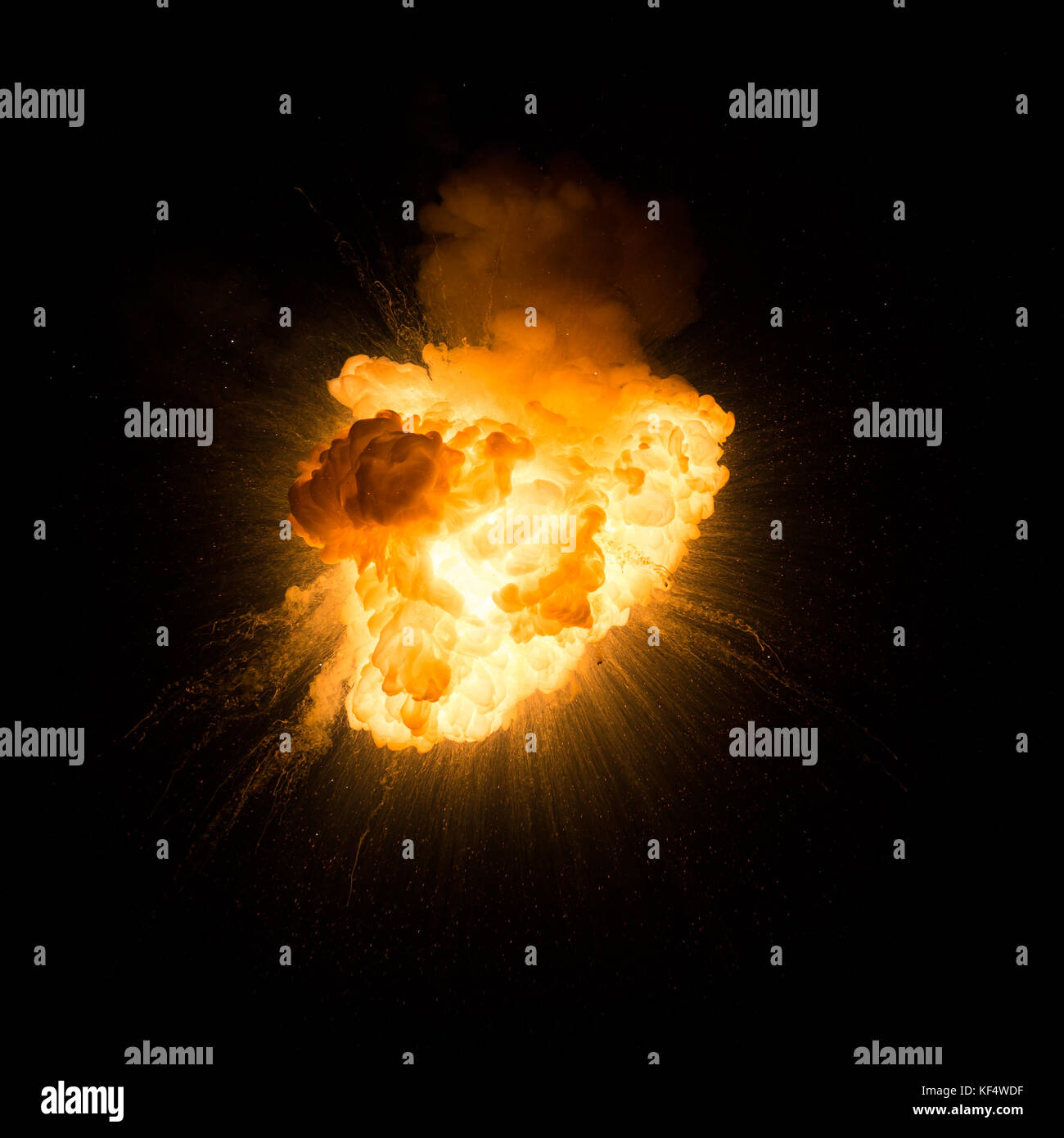 Realistic fiery explosion with sparks over a black background. Fireball ...