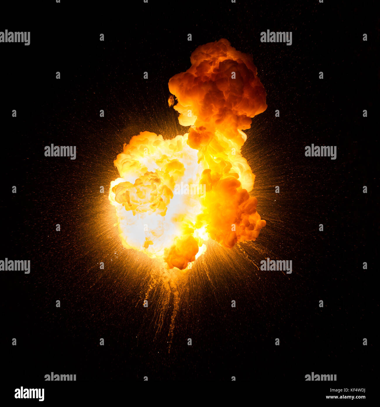 Realistic fiery explosion with sparks over a black background. Fireball ...