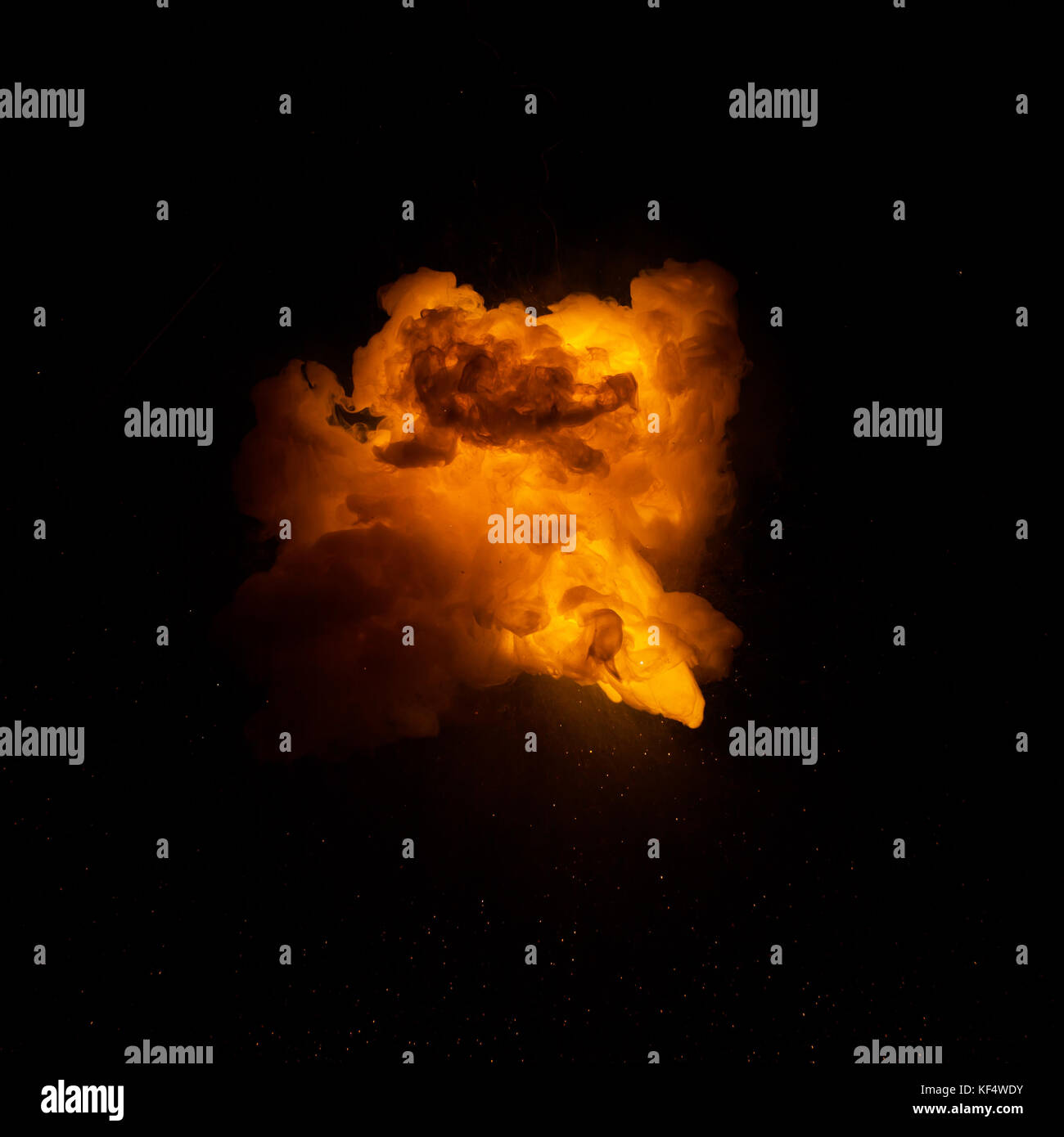 Realistic fiery explosion with sparks over a black background. Fireball ...