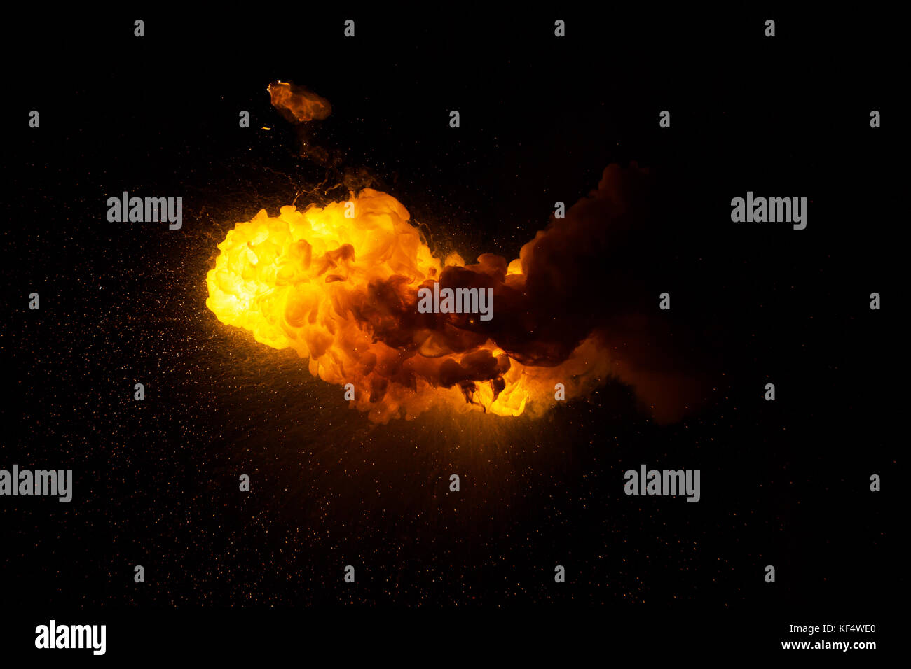 Realistic fiery explosion with sparks over a black background. Fireball ...