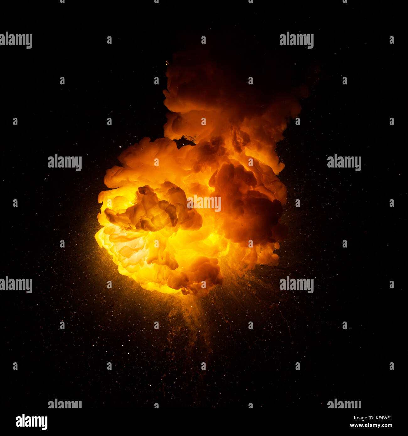 Realistic fiery explosion with sparks over a black background. Fireball ...