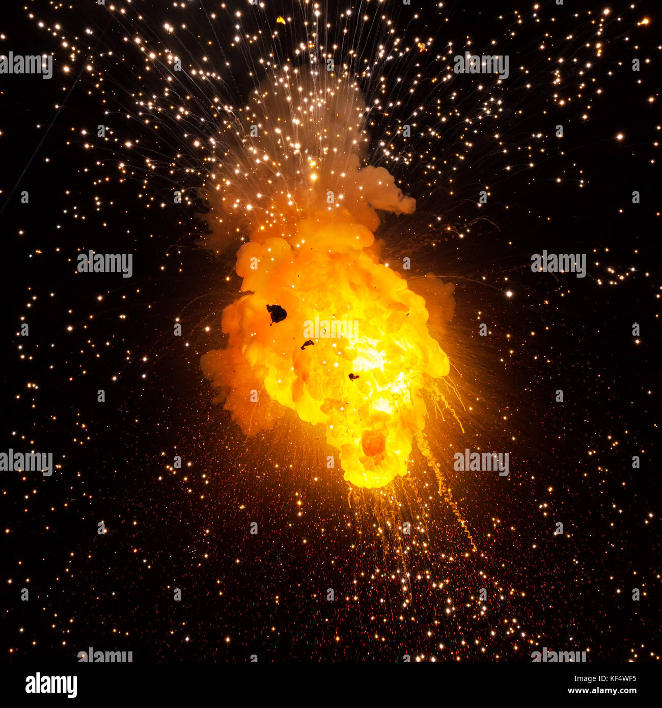 Realistic fiery explosion with sparks over a black background. Fireball ...