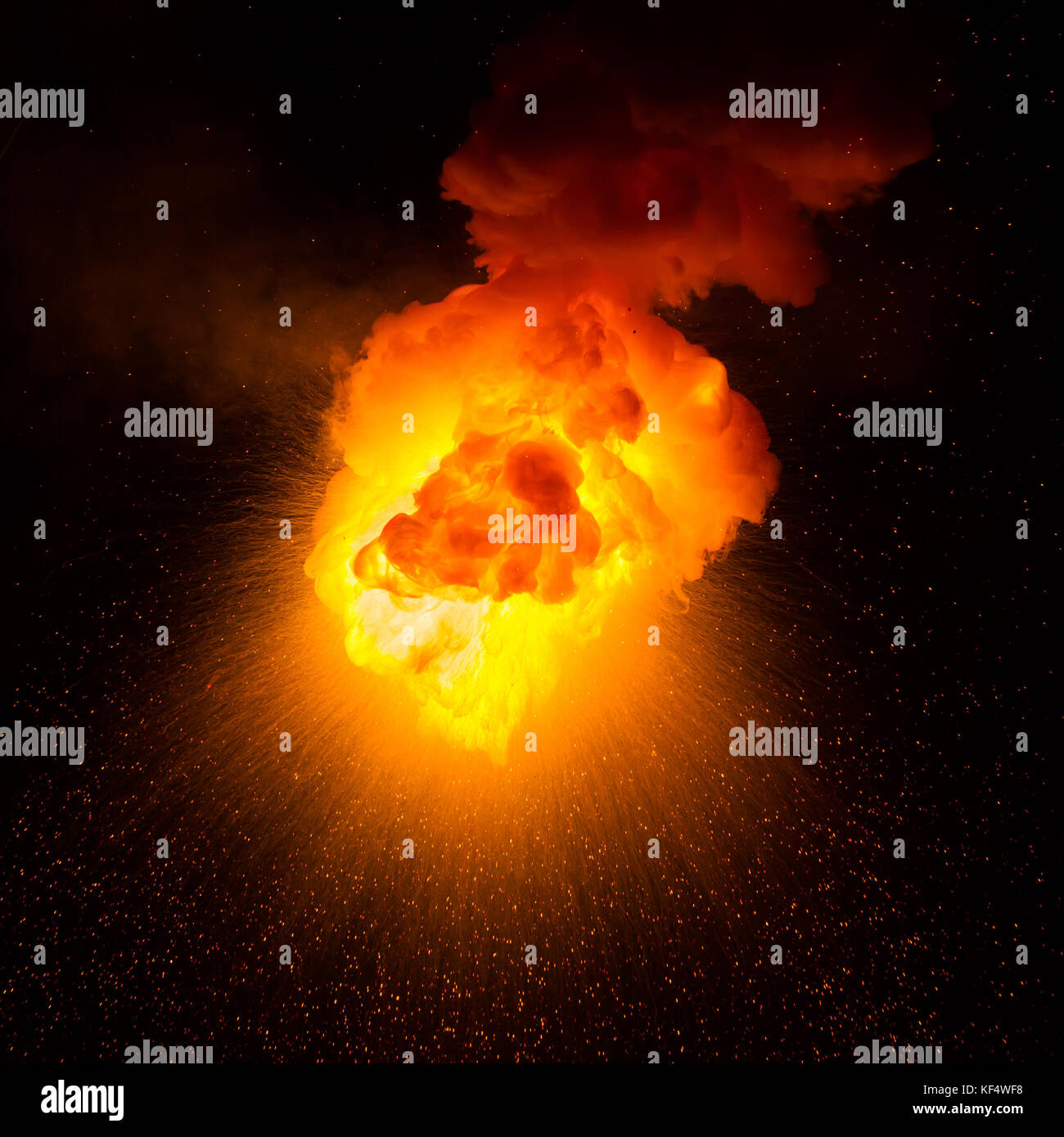 Realistic fiery explosion with sparks over a black background. Fireball ...