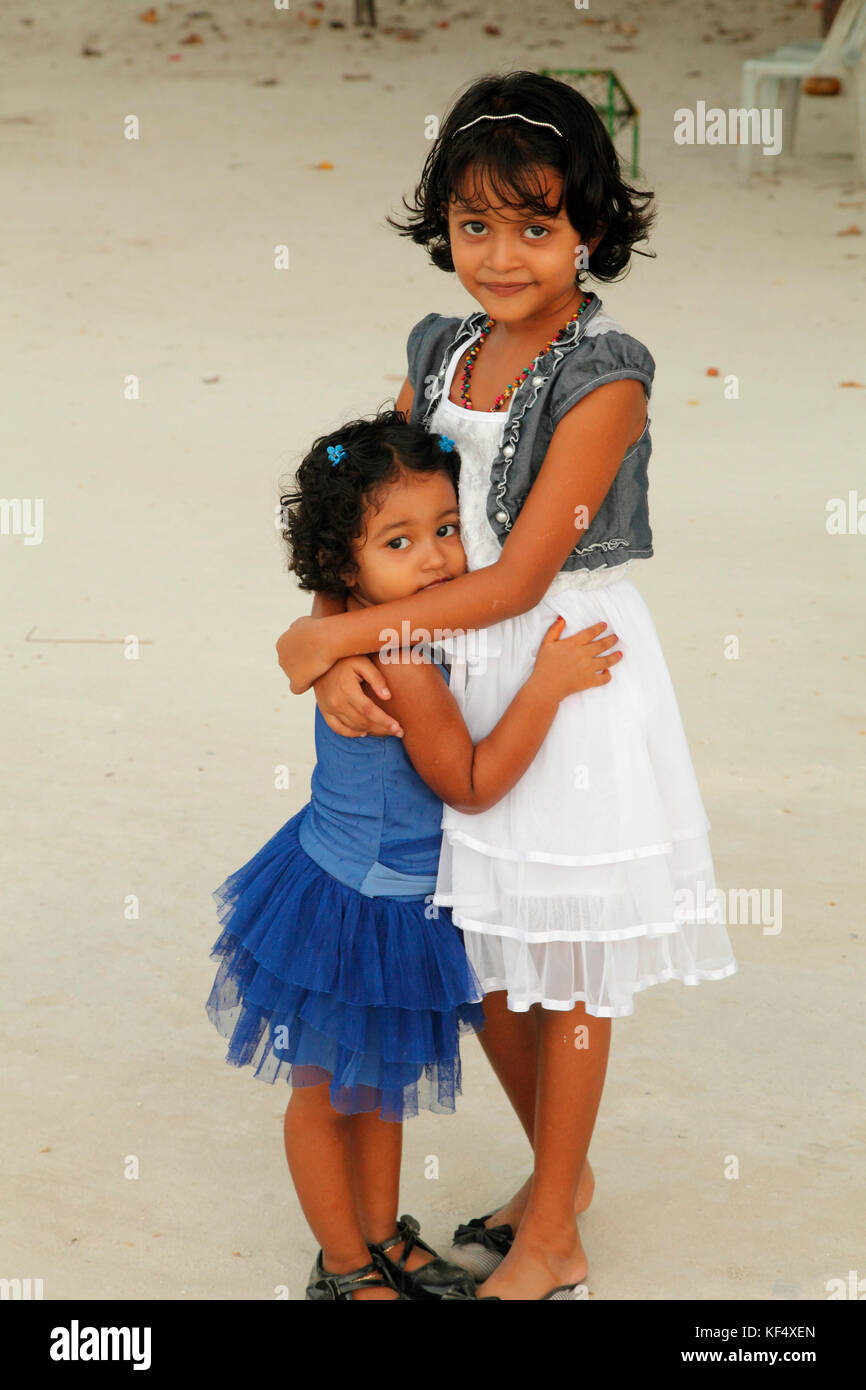 Maldives, Maafushi Island, little girls Stock Photo - Alamy
