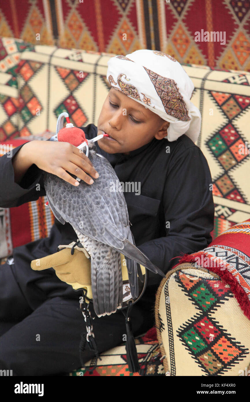 Qatar, Doha, Souq Waqif, boy with falcon Stock Photo - Alamy