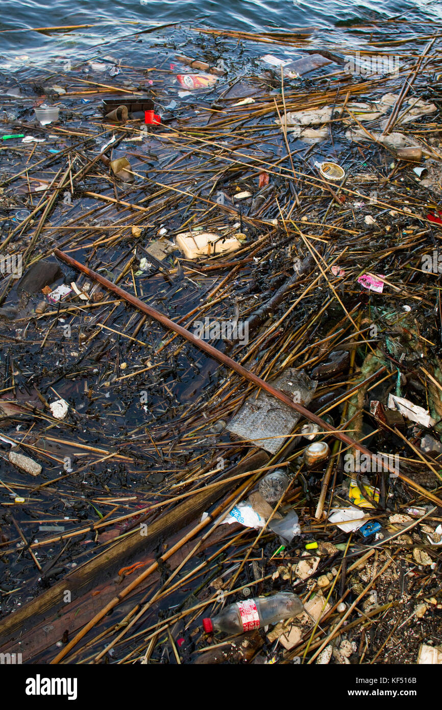 Rubbish floating on water Stock Photo - Alamy