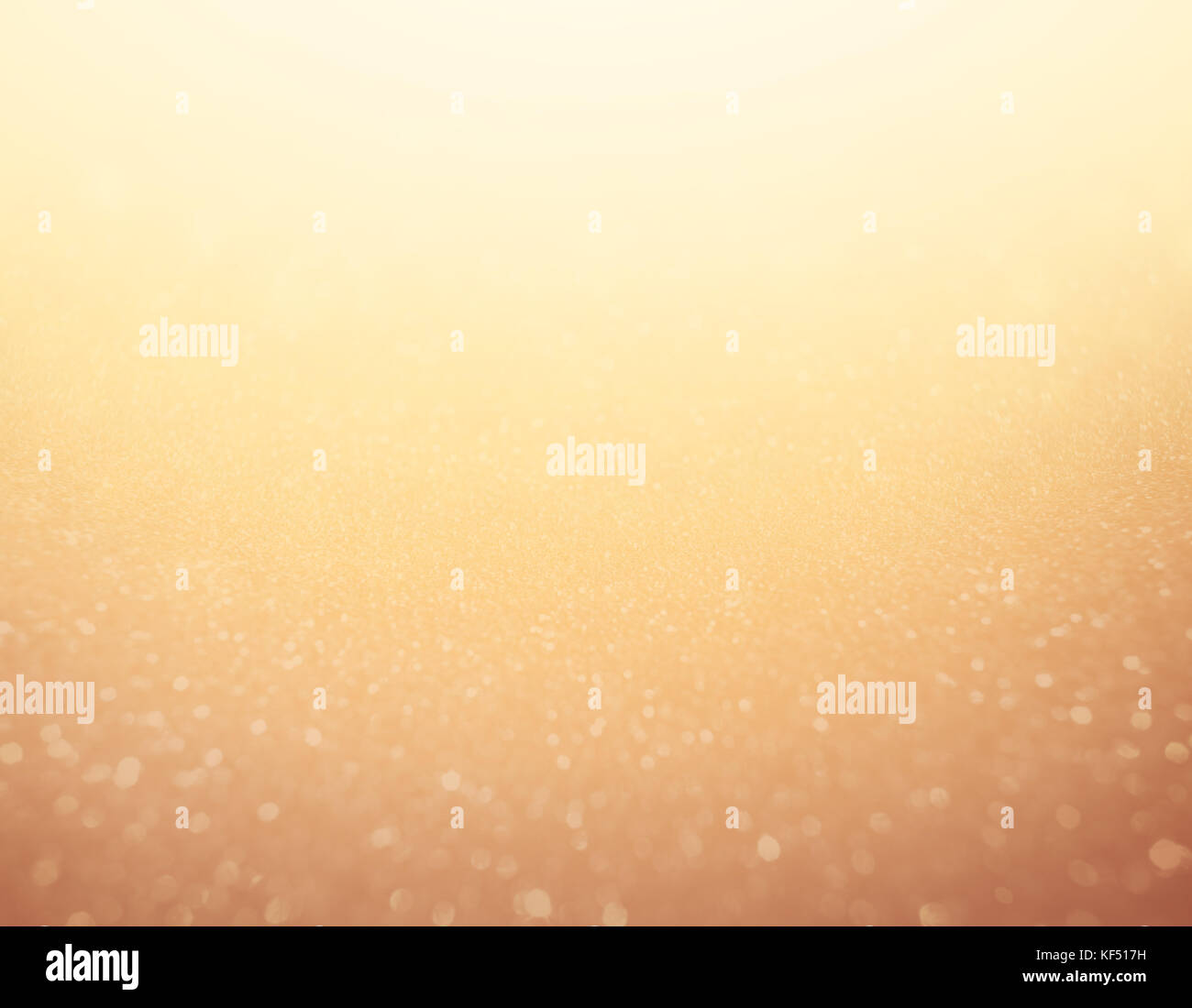 Glittering defocused gold background - Festive material Stock Photo - Alamy