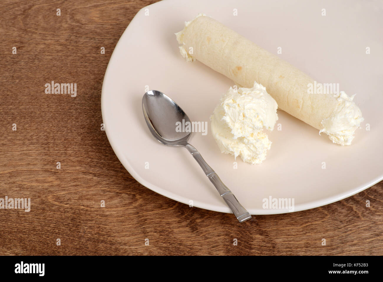 vanilla ice cream crepe with a spoon Stock Photo - Alamy
