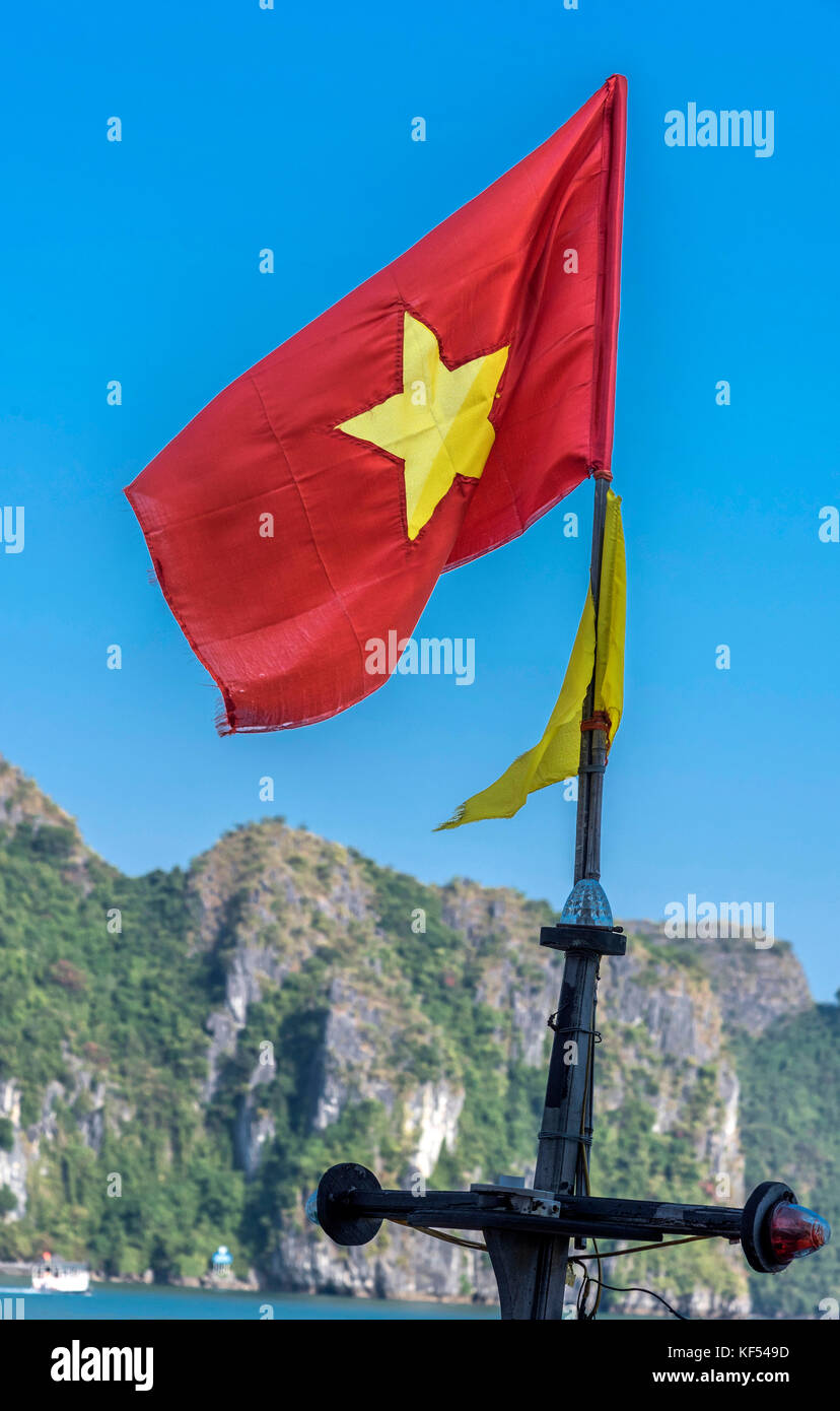 Vietnam, Ha Long Bay, national flag on a junk (UNESCO World Heritage ...