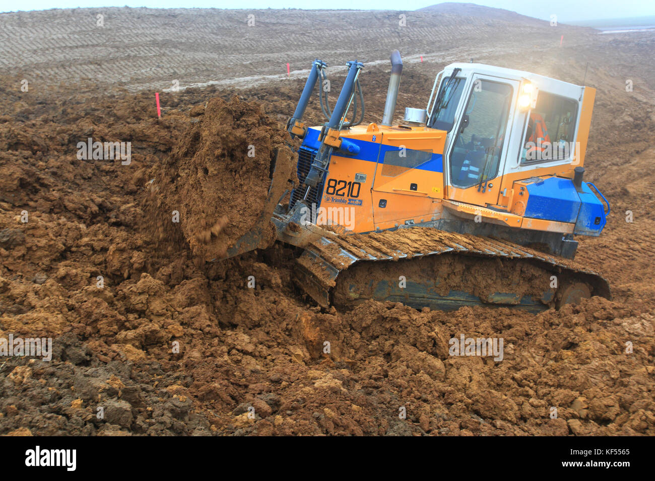 Machine on a building site of earthwork Stock Photo - Alamy
