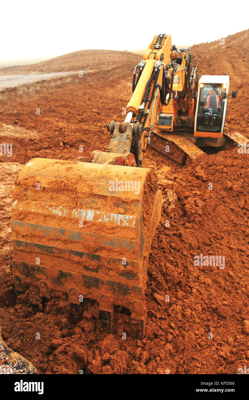 Machine on a building site of earthwork Stock Photo - Alamy