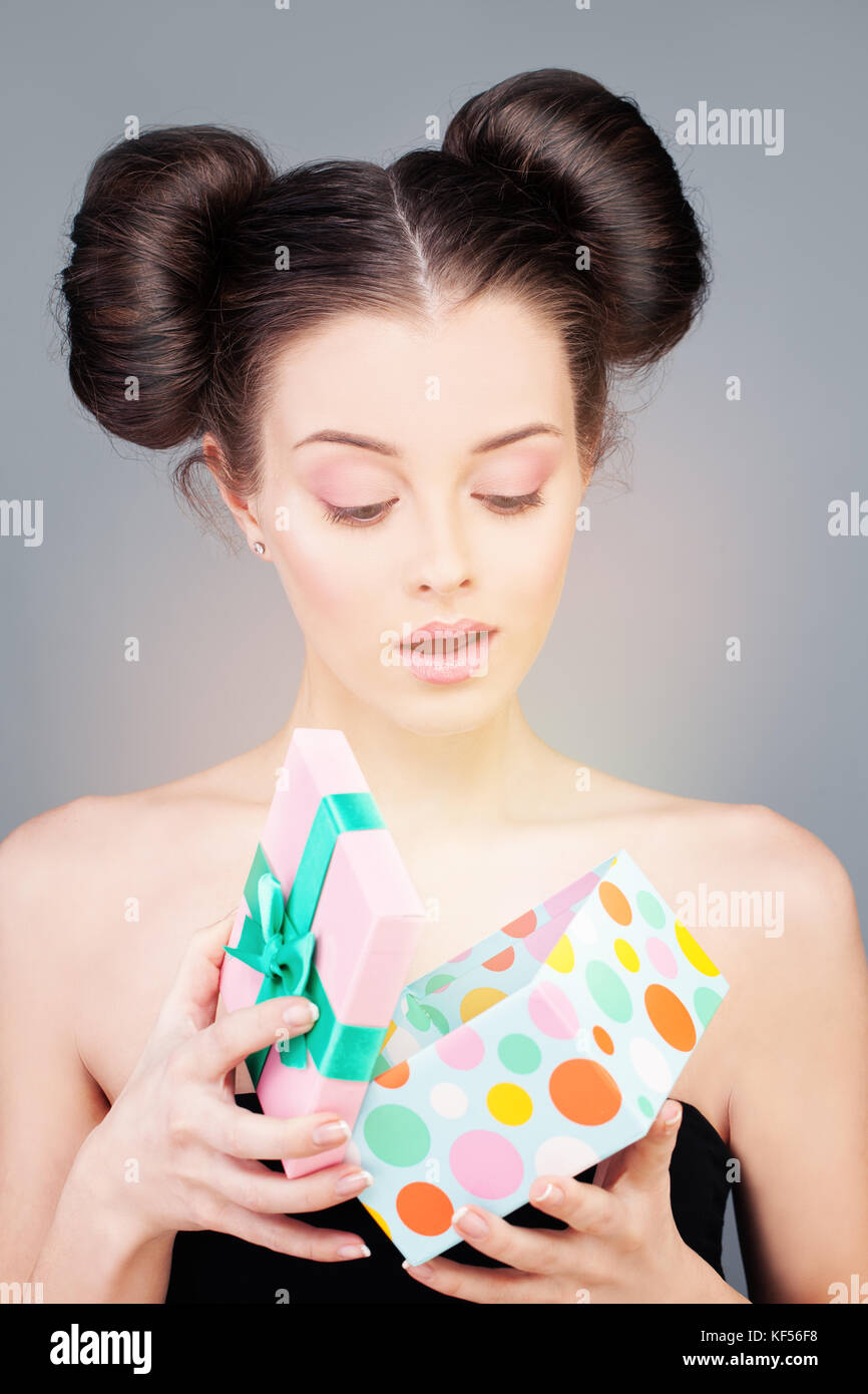Pretty Girl with Gift Box. Surprised Fashion Model Stock Photo - Alamy