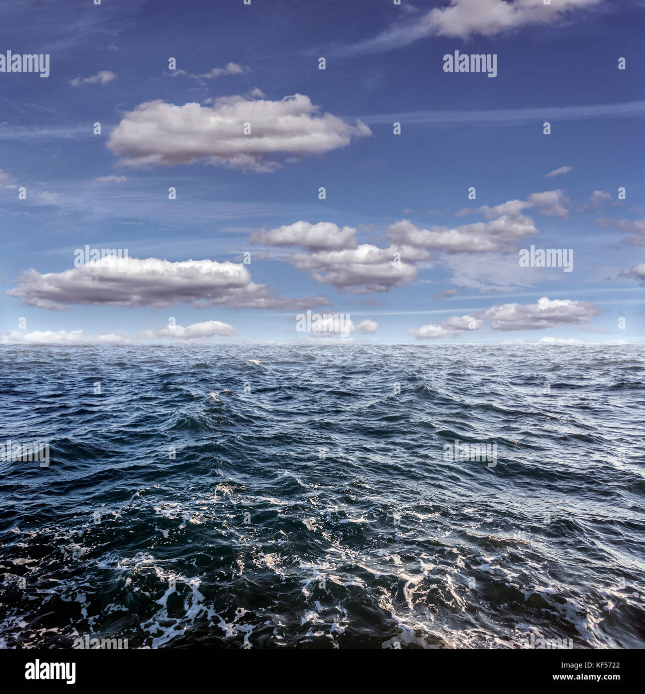 Blue sky with clouds over the sea Stock Photo - Alamy