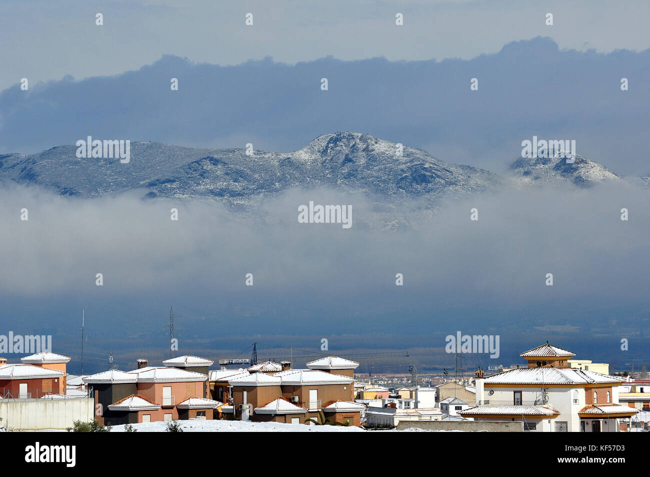 Snowy landscape with city, mountains floating and clouds Stock Photo ...