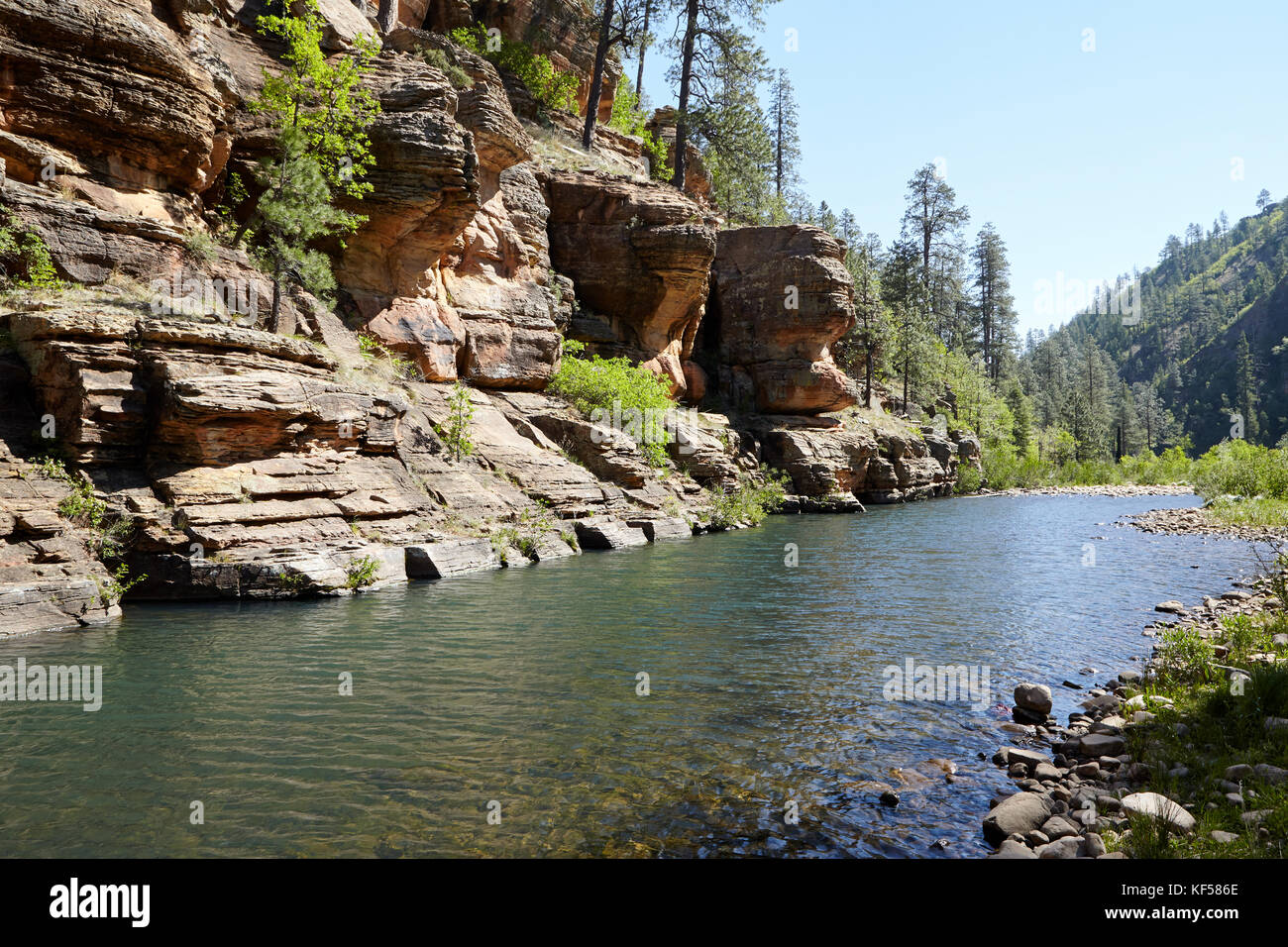 Eroded rocks above pond in mountains on sunny day, Arizona, USA Stock ...