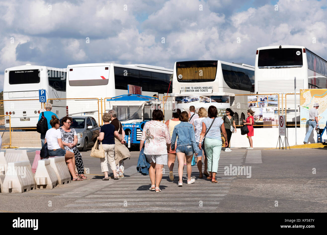 Agios Nikolas Crete, Greece October 2017. Tourists at the tour bus ...