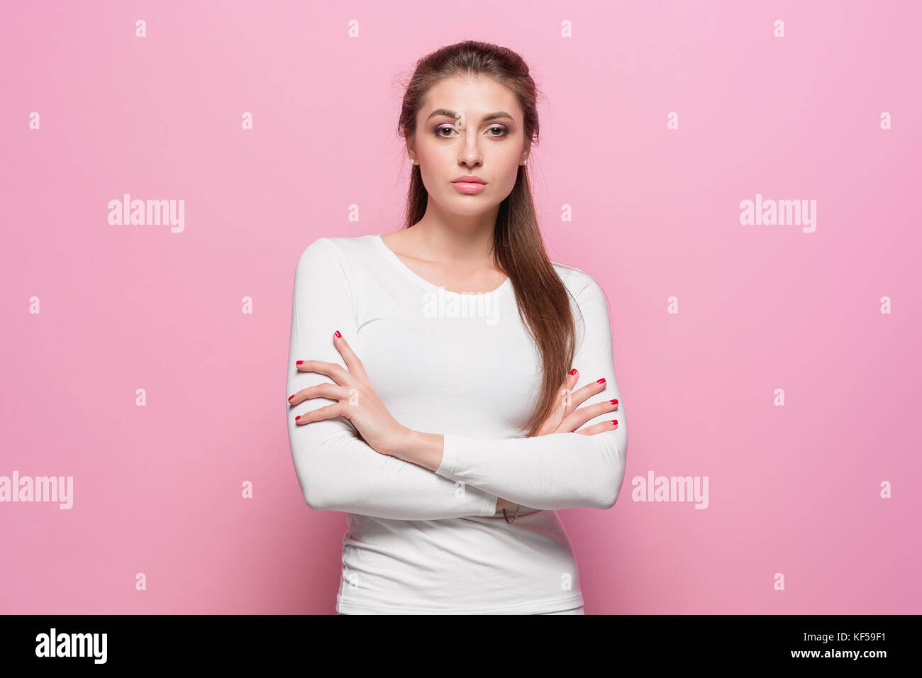 The young woman's portrait with proud and arrogant emotions Stock Photo ...