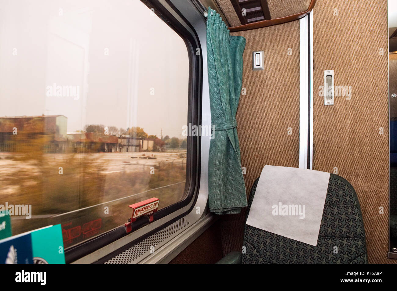 An empty passenger train seat and motion blurred window view Stock ...