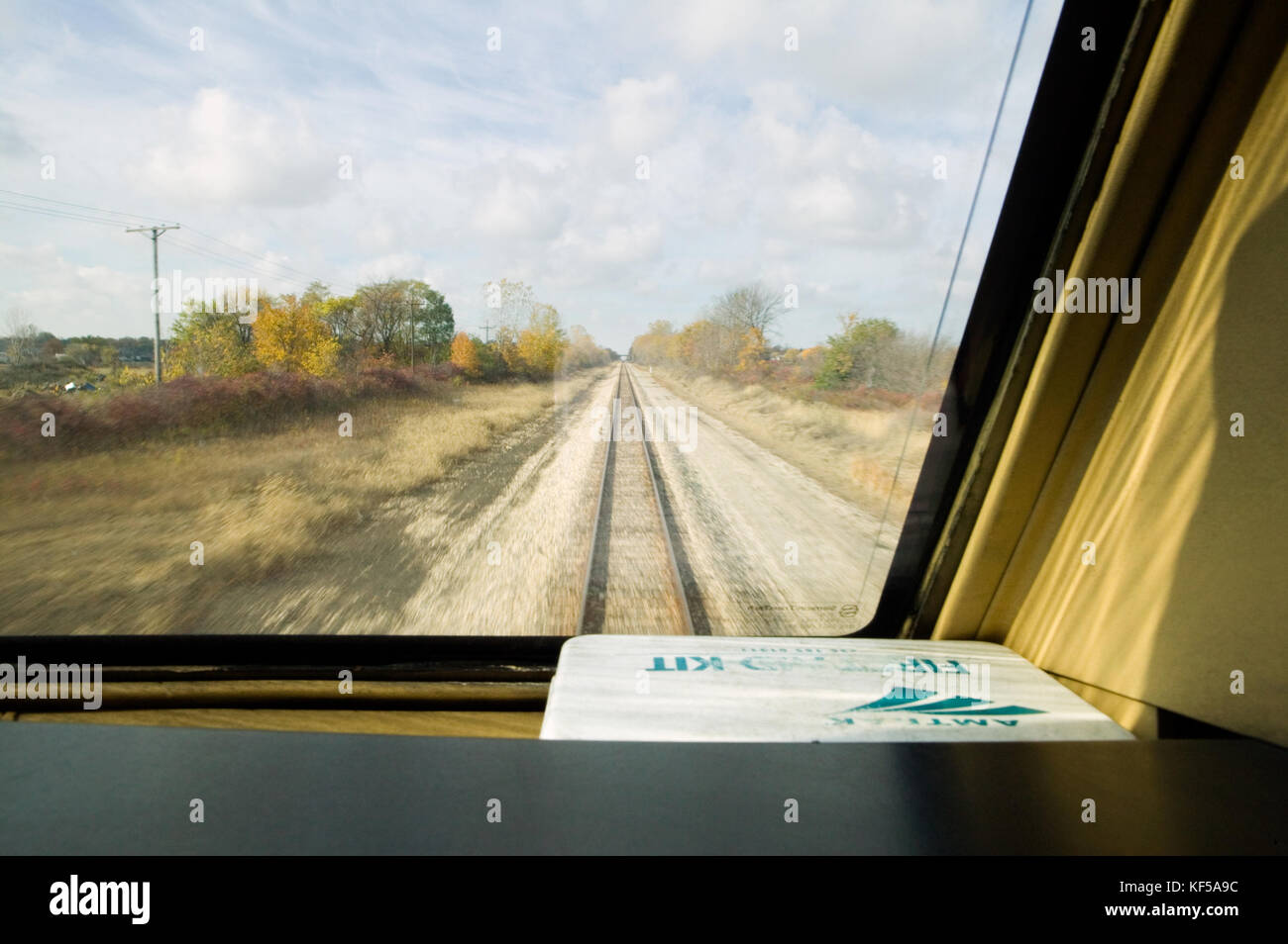 A passengers view of receding railway tracks from the rear window of a ...