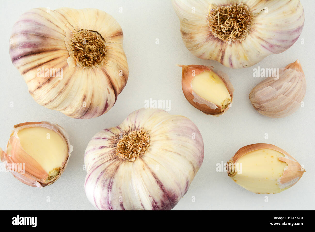 Closeup of garlic cloves and bulbs on a white background Stock Photo ...