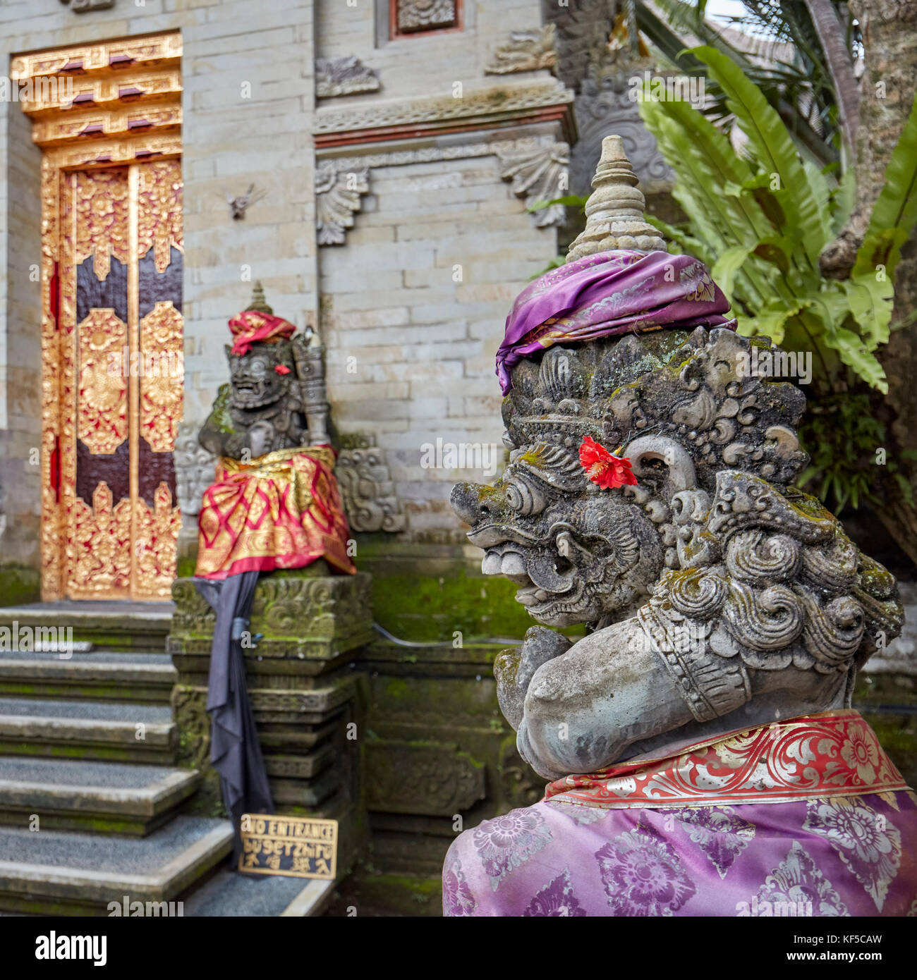 Carved stone statues in Puri Saren Agung, also known as Ubud Palace ...